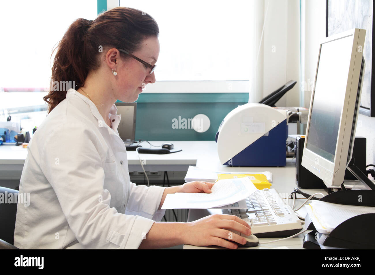 woman technician in histology labor controlling the work flow Caucasian ...