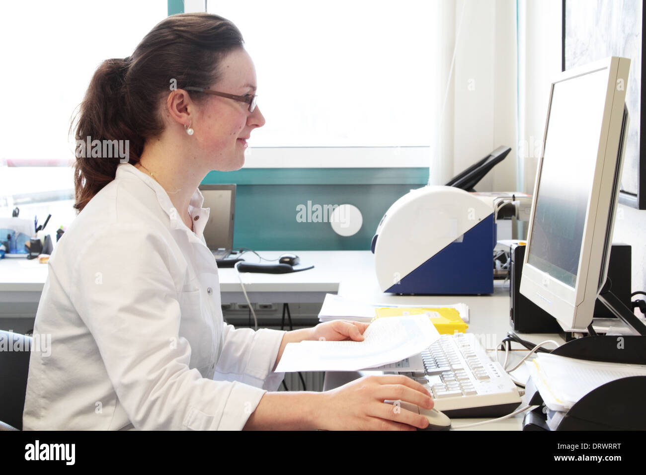 woman technician in histology labor controlling the work flow Caucasian ...