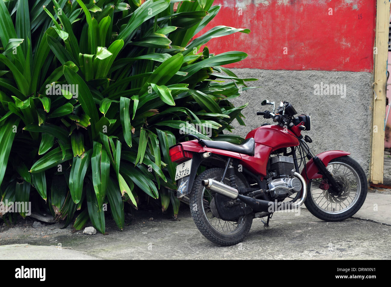 Havana, Cuba: motor cycle outside a house in the Casa Blanca district ...