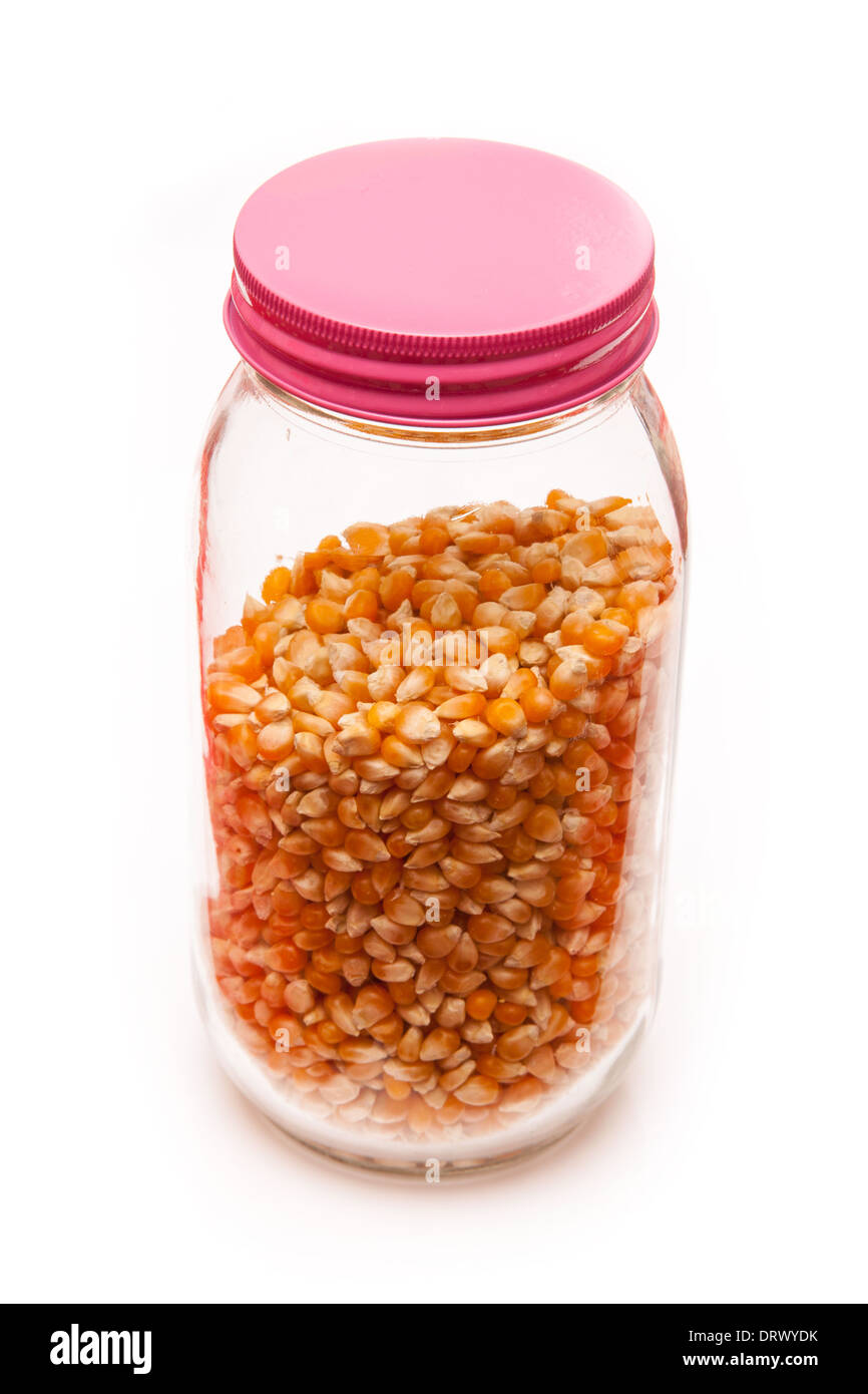 Jar of popcorn kernels isolated on a white studio background Stock ...