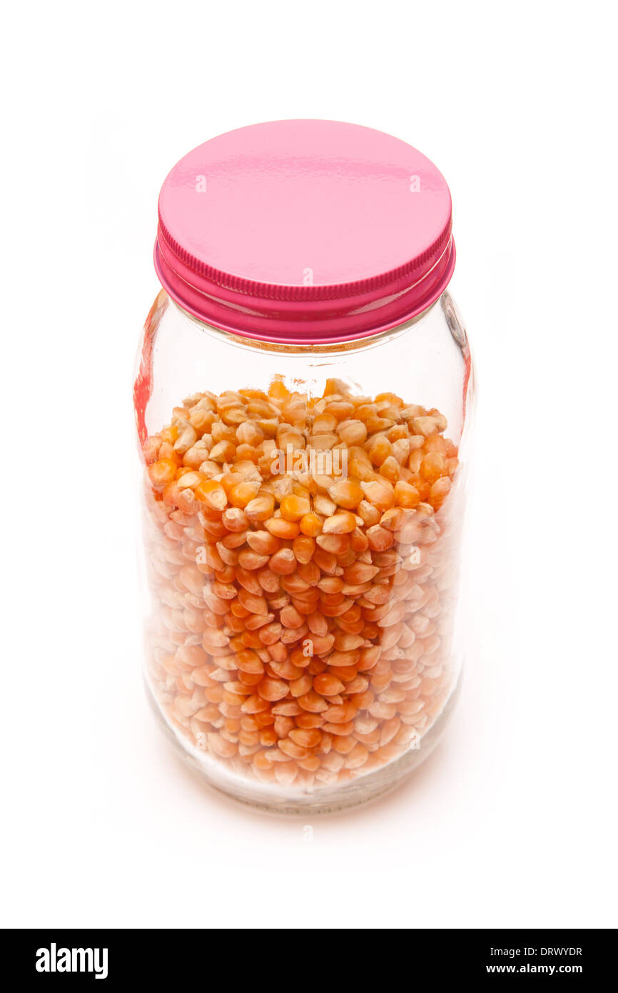 Jar of popcorn kernels isolated on a white studio background Stock ...