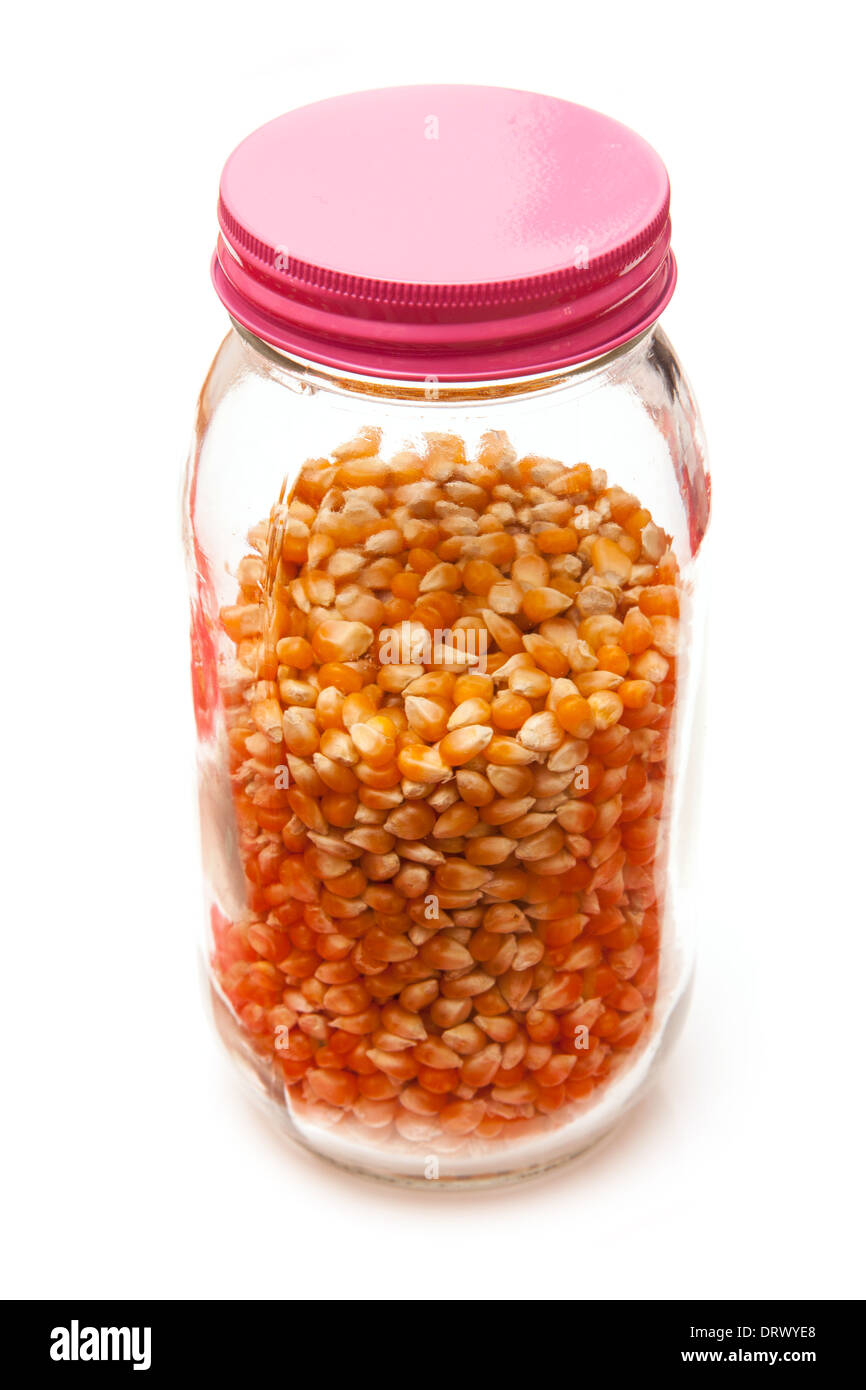 Jar of popcorn kernels isolated on a white studio background Stock ...