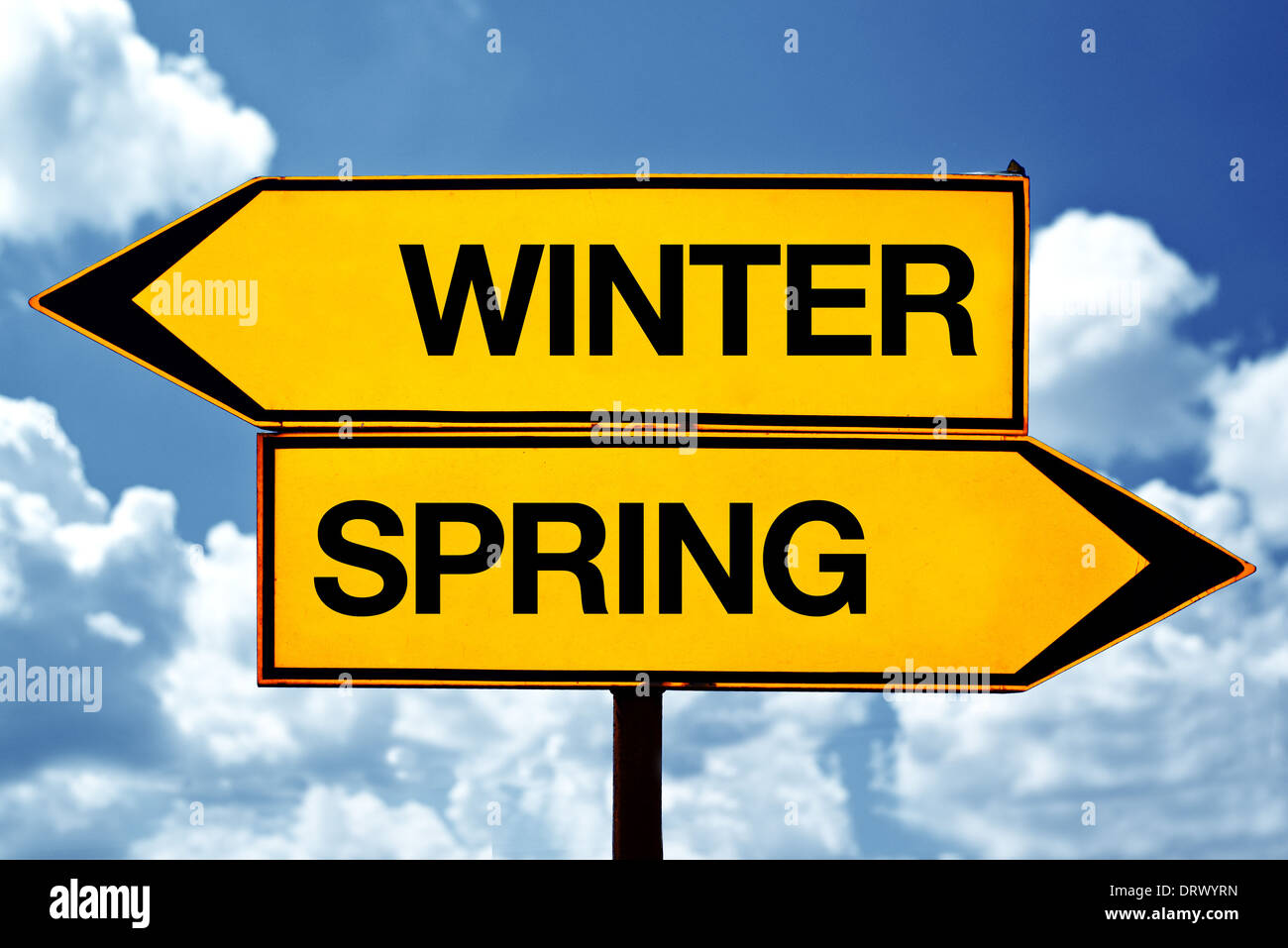 Winter or spring opposite signs. Two blank opposite signs against blue ...