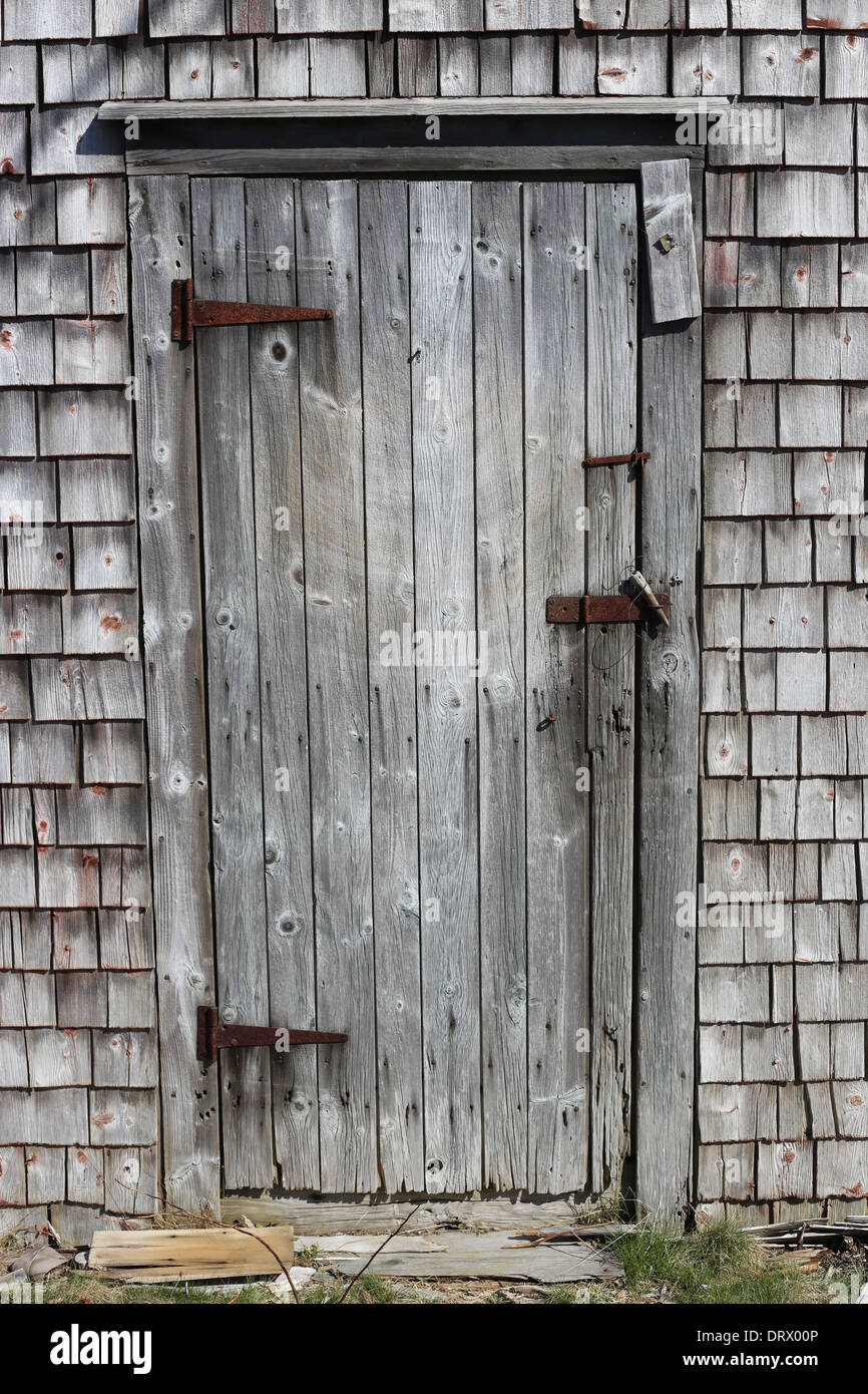 an old wooden door on a weathered old fish shack in Nova Scotia Stock ...