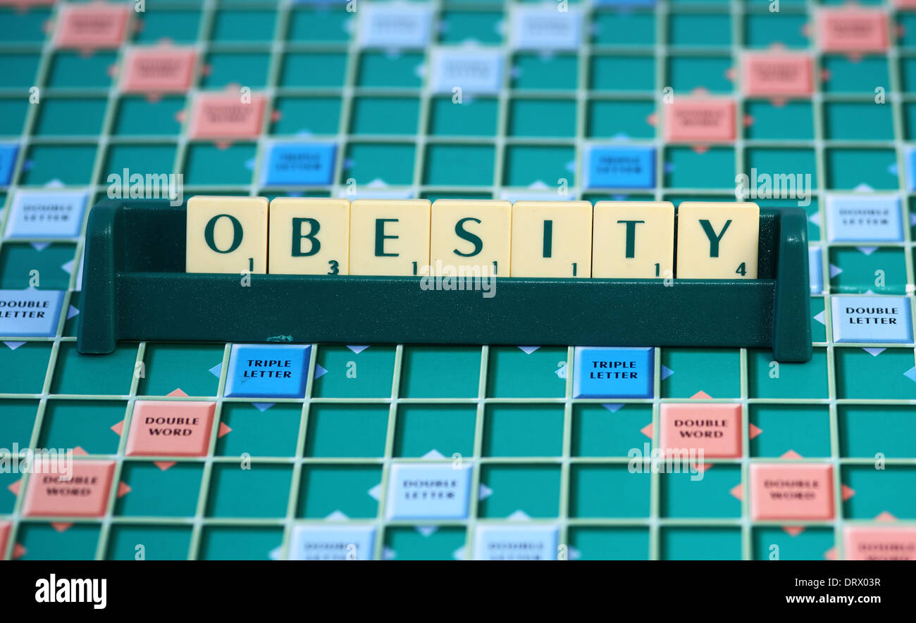 scrabble board game tiles obesity Stock Photo - Alamy