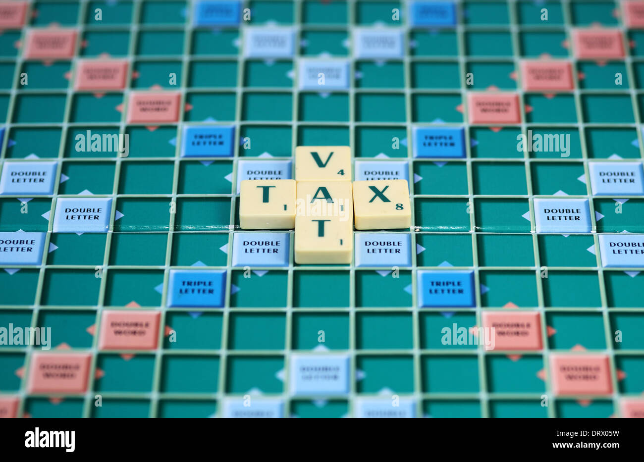 scrabble board game tiles tax Stock Photo - Alamy