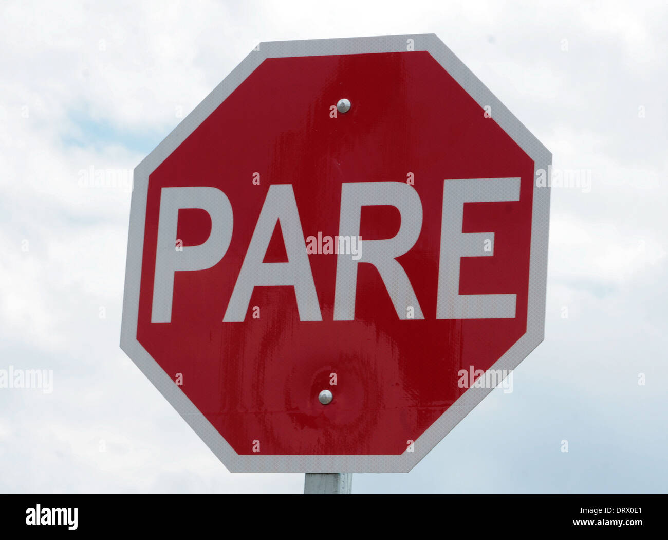 A stop sign in Spanish on the side of a road in Cotacachi, Ecuador ...