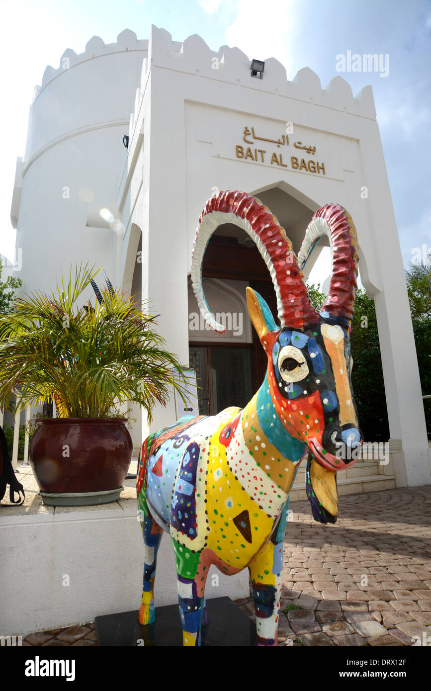Muscat OMAN - a decorative goat stands at the entrance to the Bait Al ...