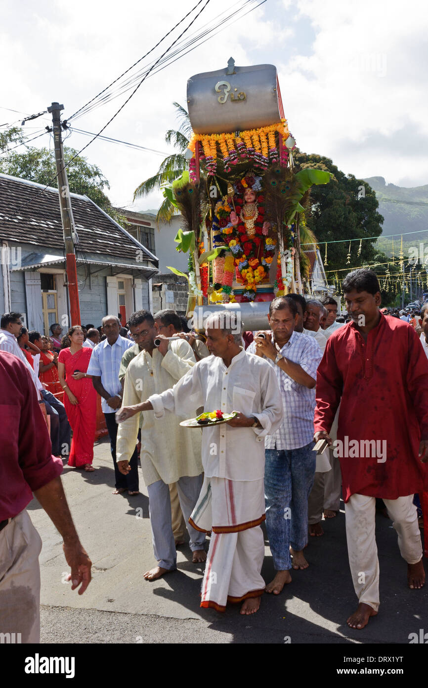 Devotees of the Lord Muruga carrying the Cavadee during the Thaipoosam ...