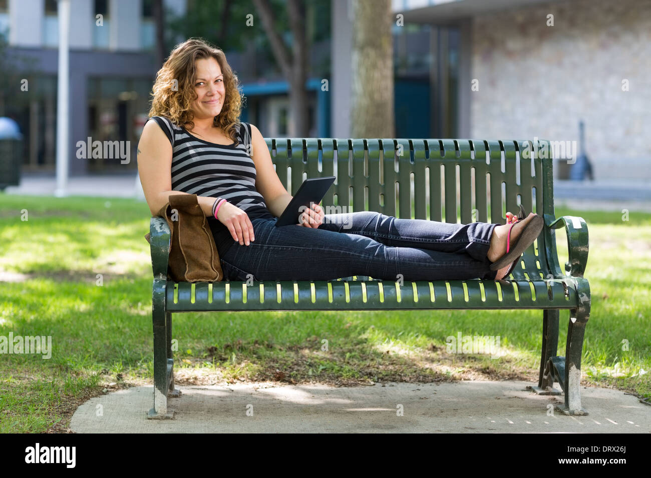 Female University Student Relaxing On Bench Stock Photo - Alamy