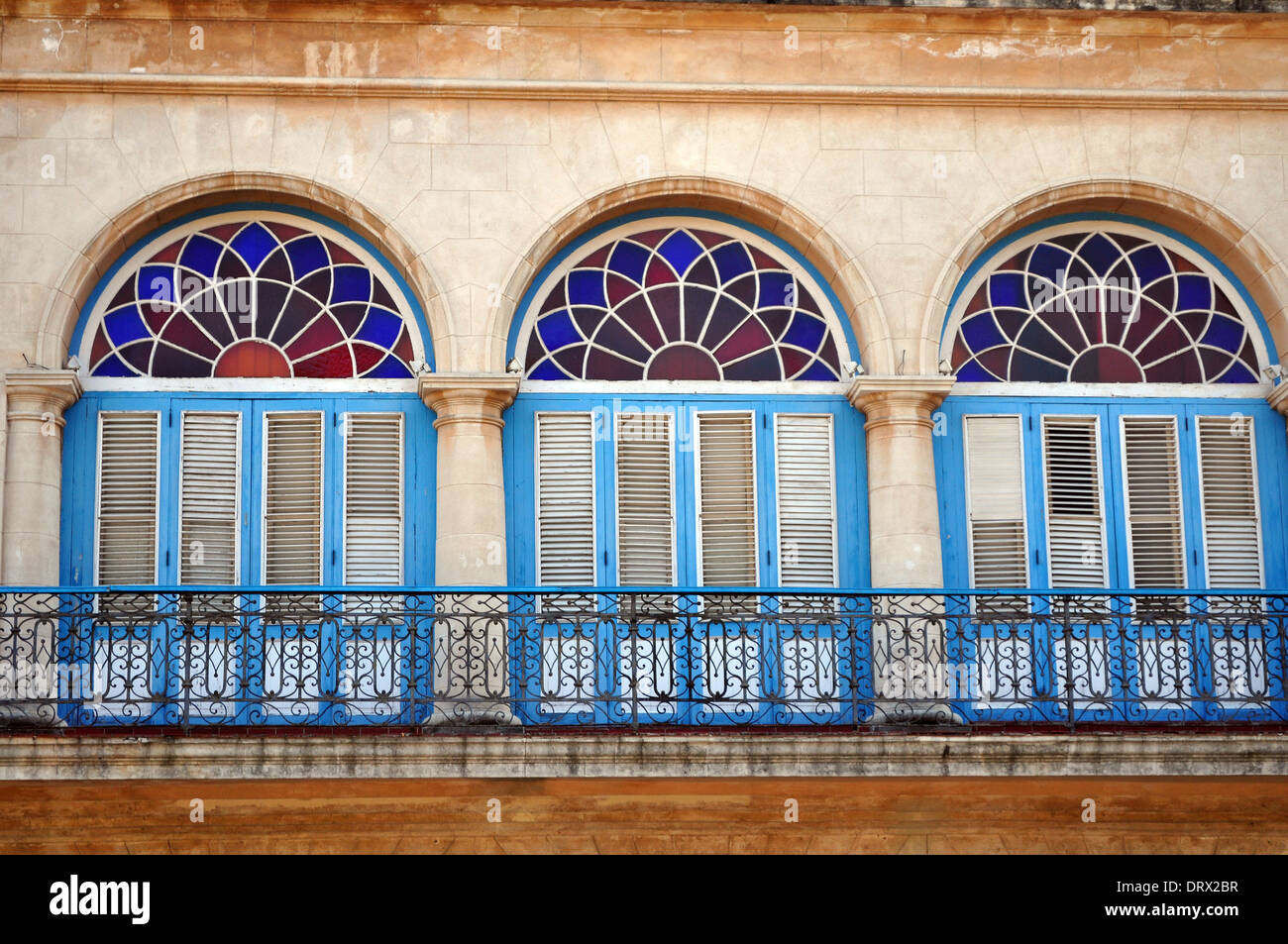 Havana, Cuba: balconies and stained glass windows on an apartment block ...