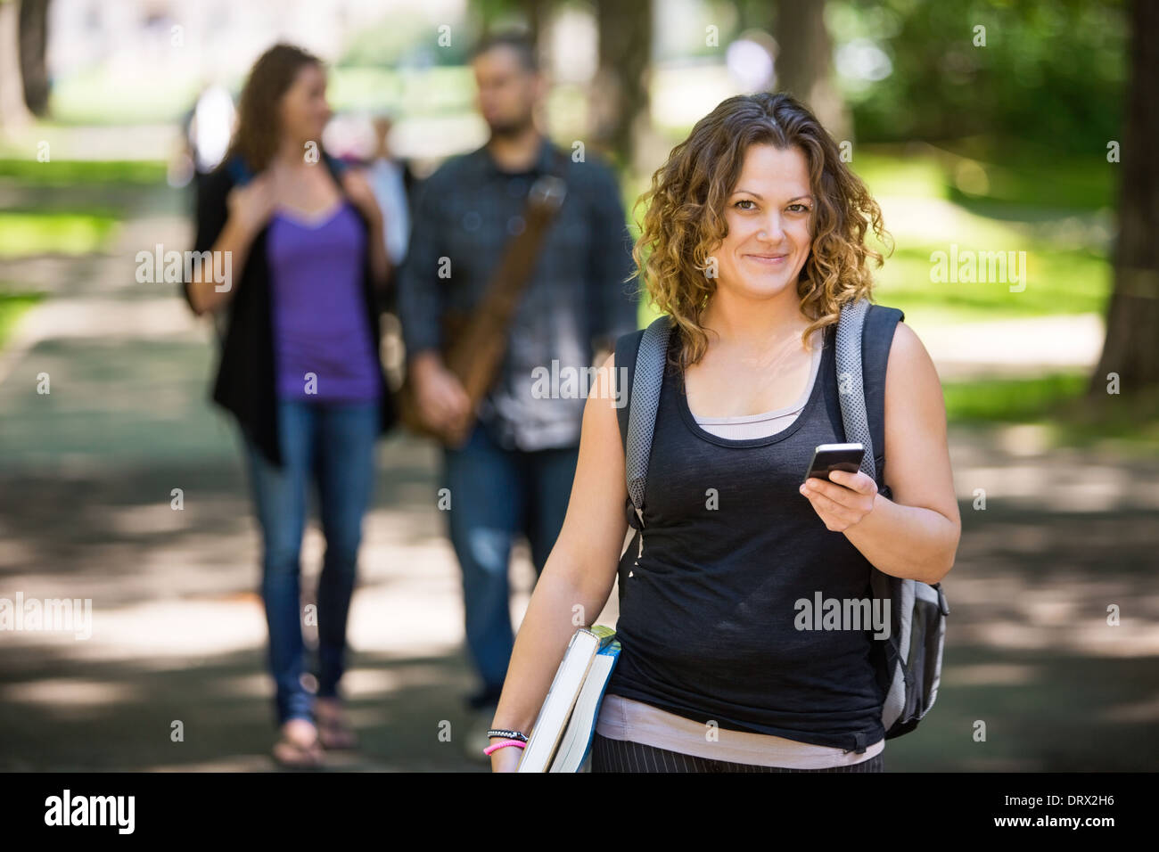 Woman phone text man walk hi-res stock photography and images - Alamy