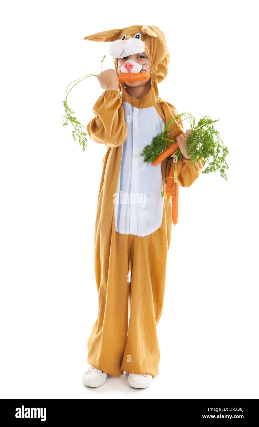 Child dressed as easter hare with carrots isolated over white ...