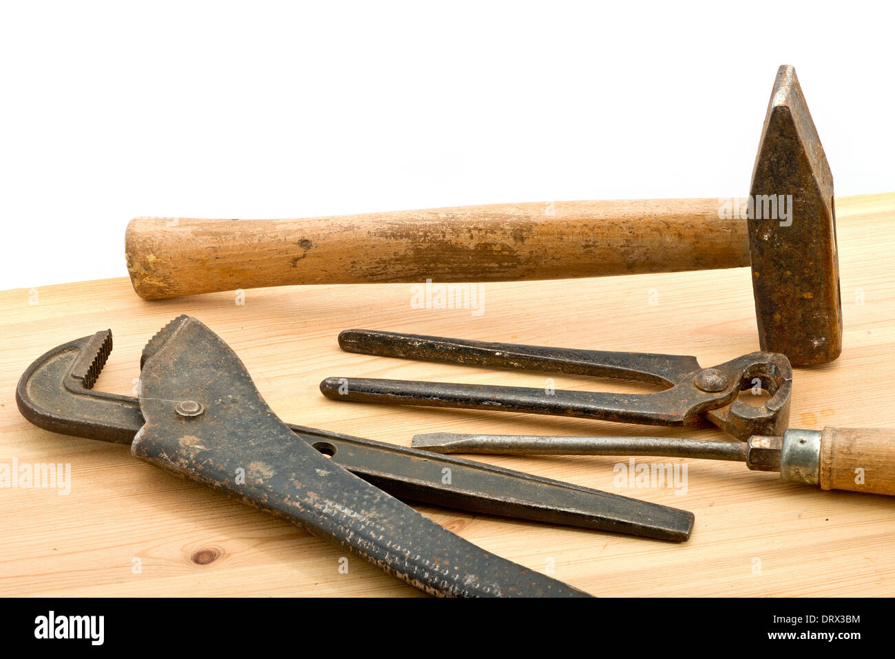 old used tools on the wooden desk Stock Photo - Alamy