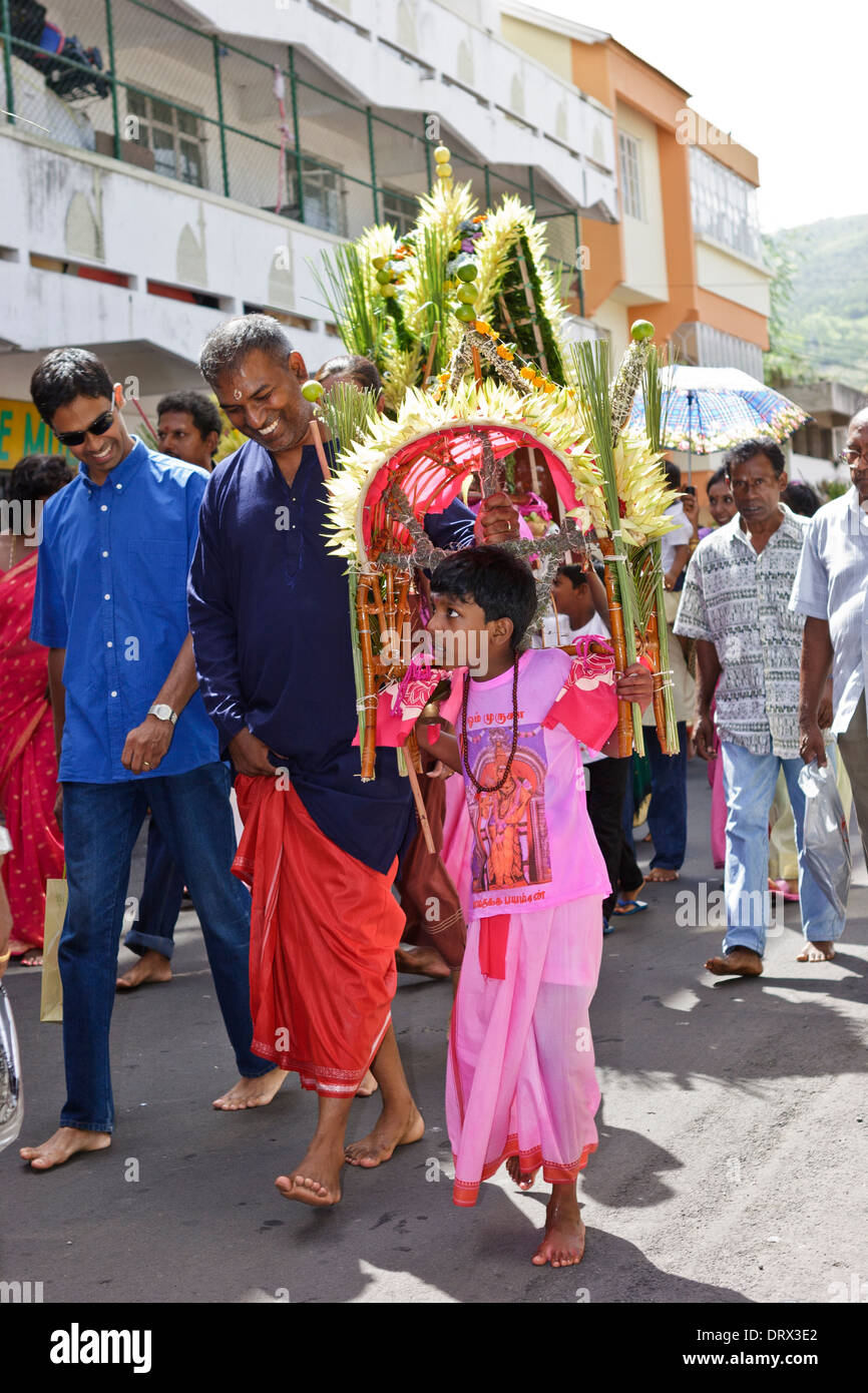Young devotee of the Lord Muruga carrying the Cavadee during the ...