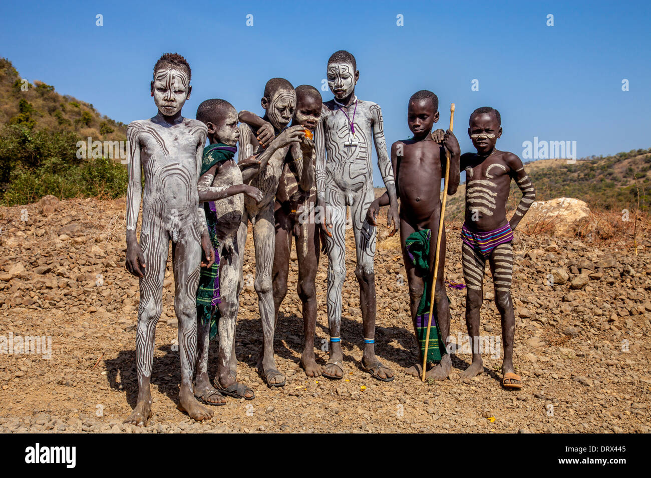 Mursi Boys Standing By The Roadside, The Omo Valley, Ethiopia Stock ...