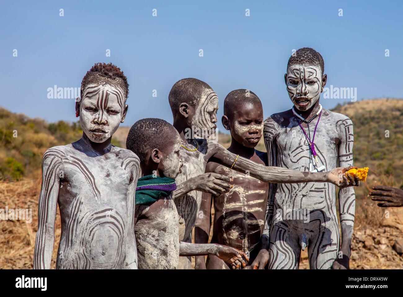 Mursi Boys Standing By The Roadside, The Omo Valley, Ethiopia Stock ...