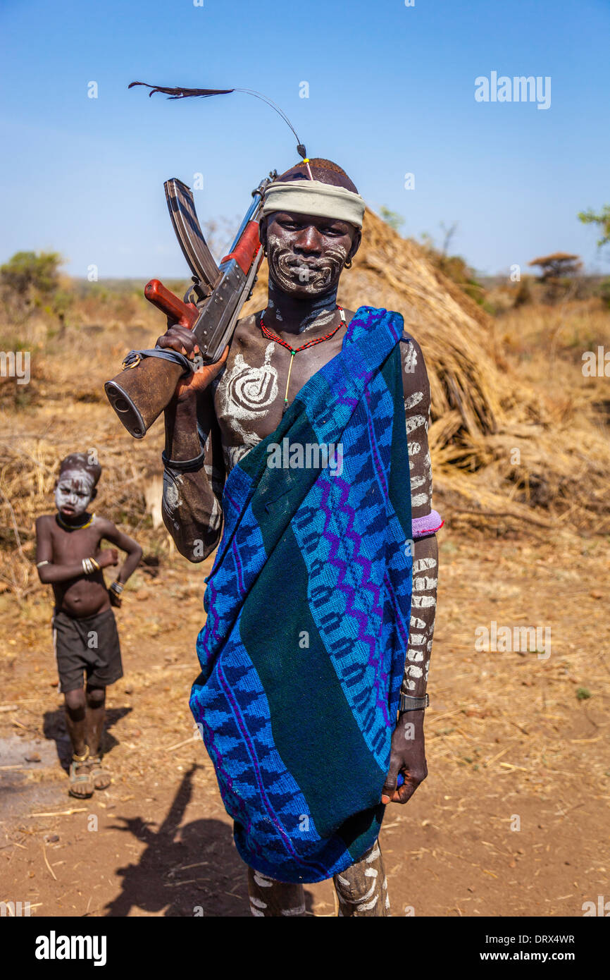 Portrait Of A Mursi Man Holding a Gun, Mursi Tribal Village, The Omo ...