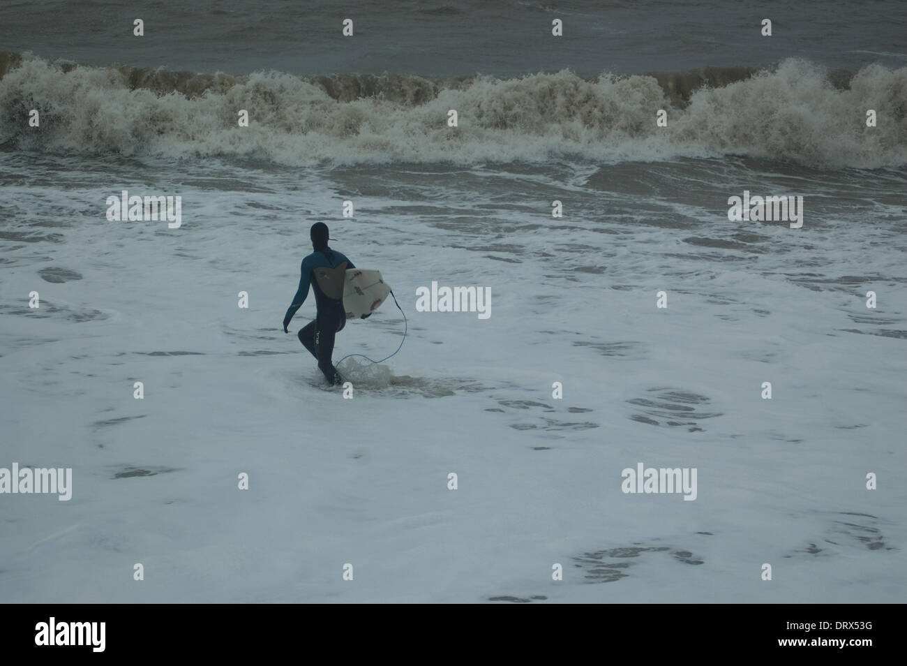 Some adventurous surfers taking advantage of the high tide swell on ...