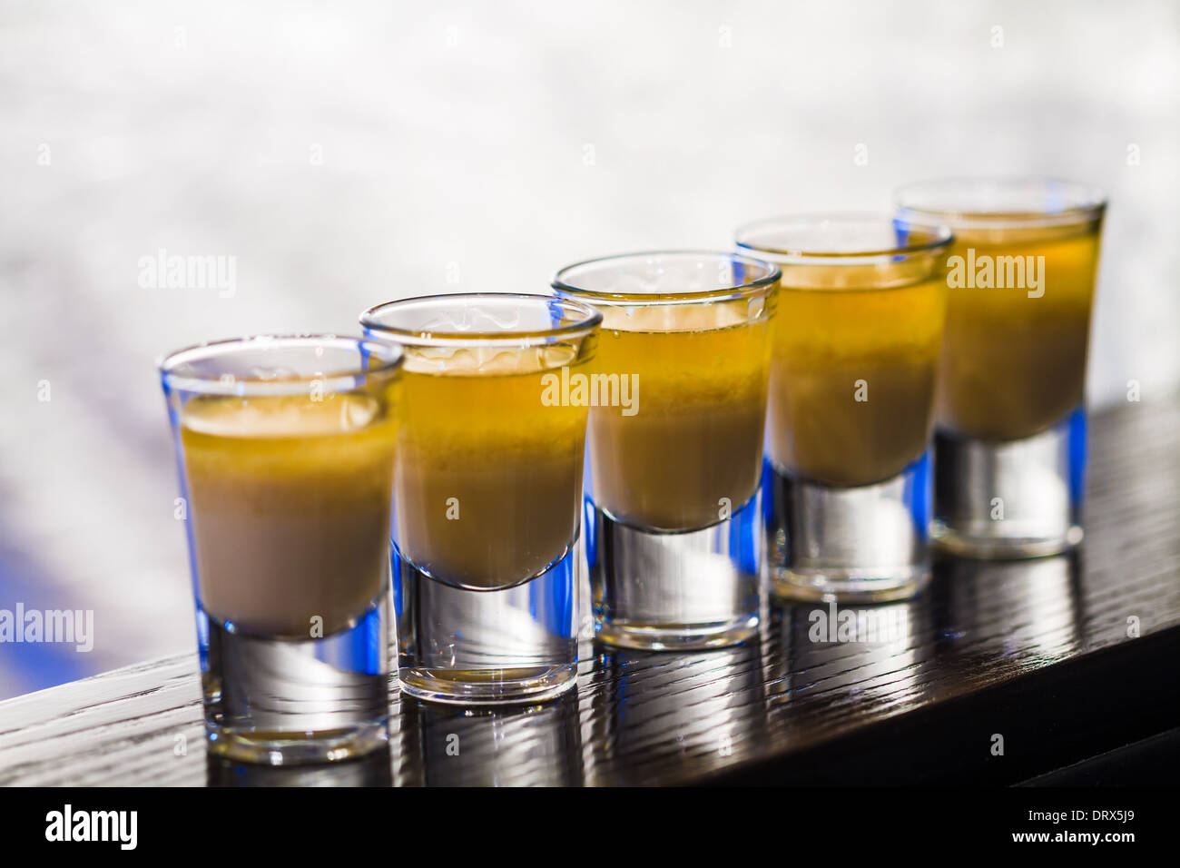 Barman make alcoholic shots in nightclub Stock Photo - Alamy