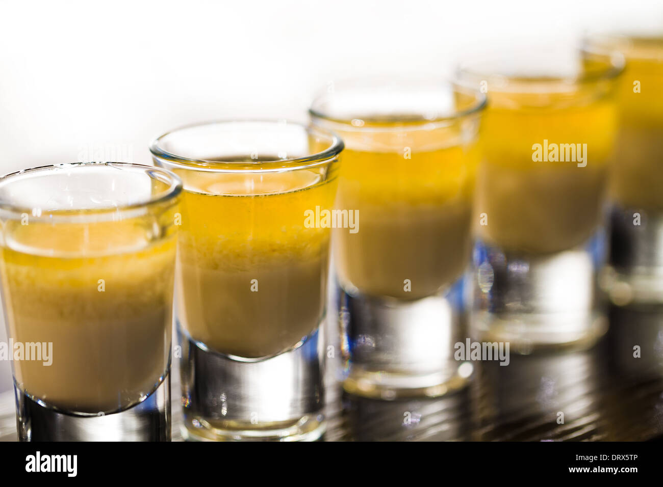 Barman make alcoholic shots in nightclub Stock Photo - Alamy