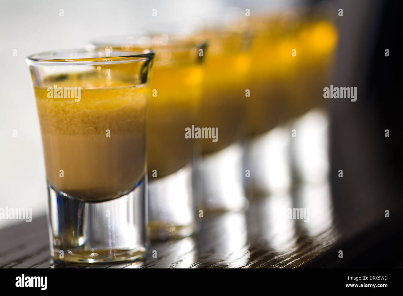 Barman make alcoholic shots in nightclub Stock Photo - Alamy