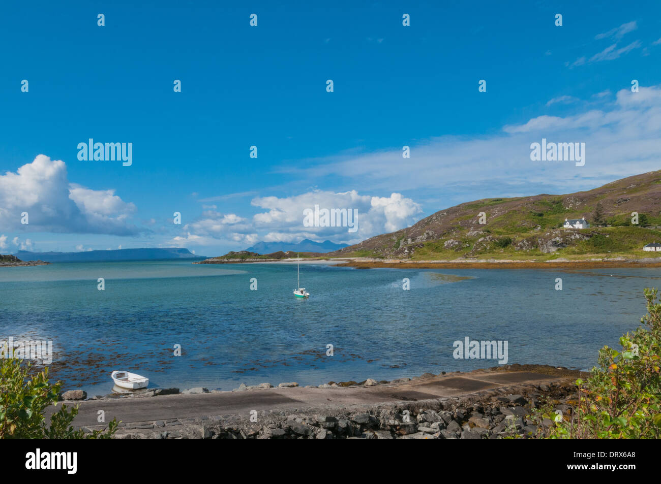 Looking over River Morar to Morar sands with yacht at anchor with Isle ...
