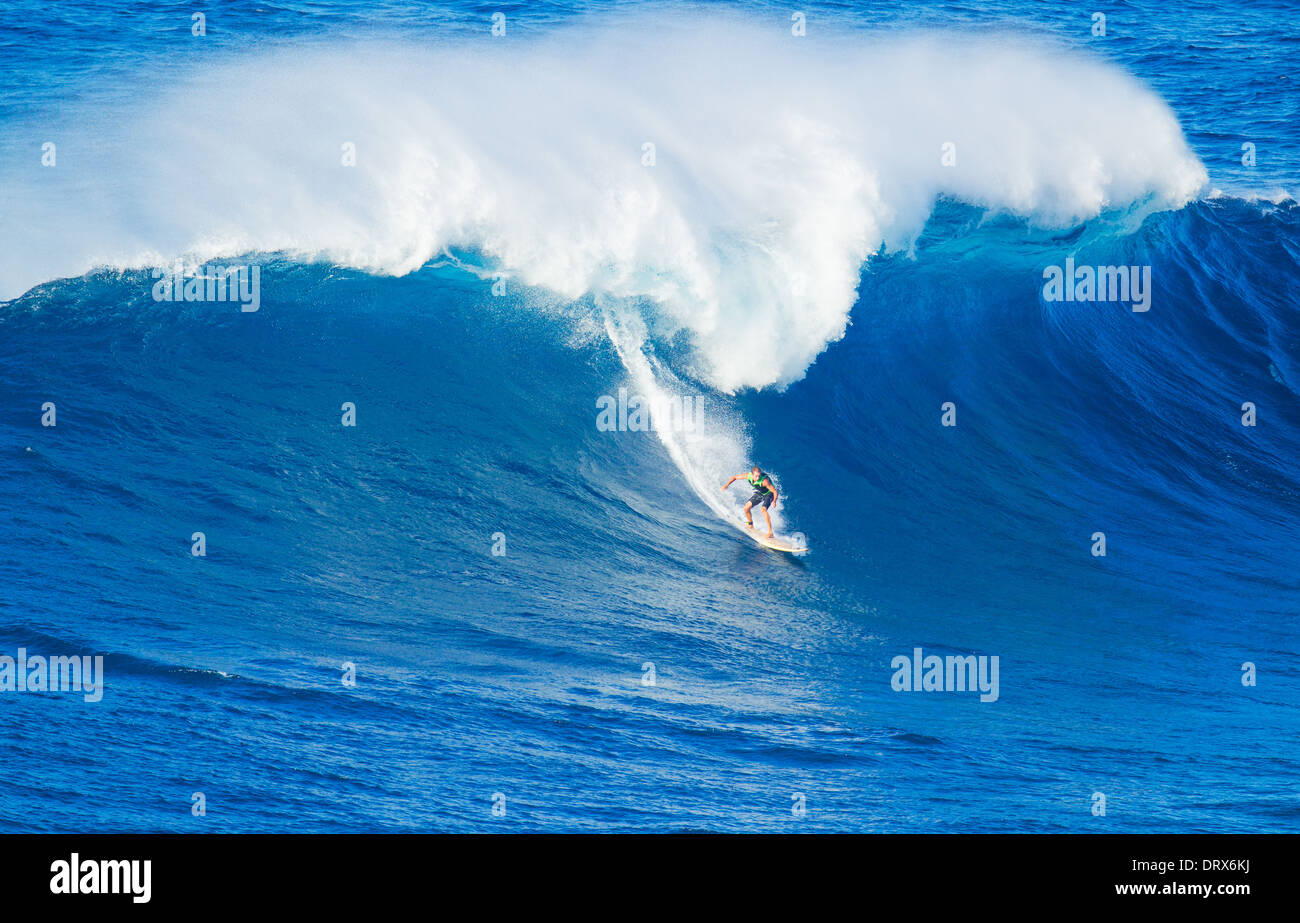 Extreme surfer riding giant ocean wave in Hawaii Stock Photo - Alamy