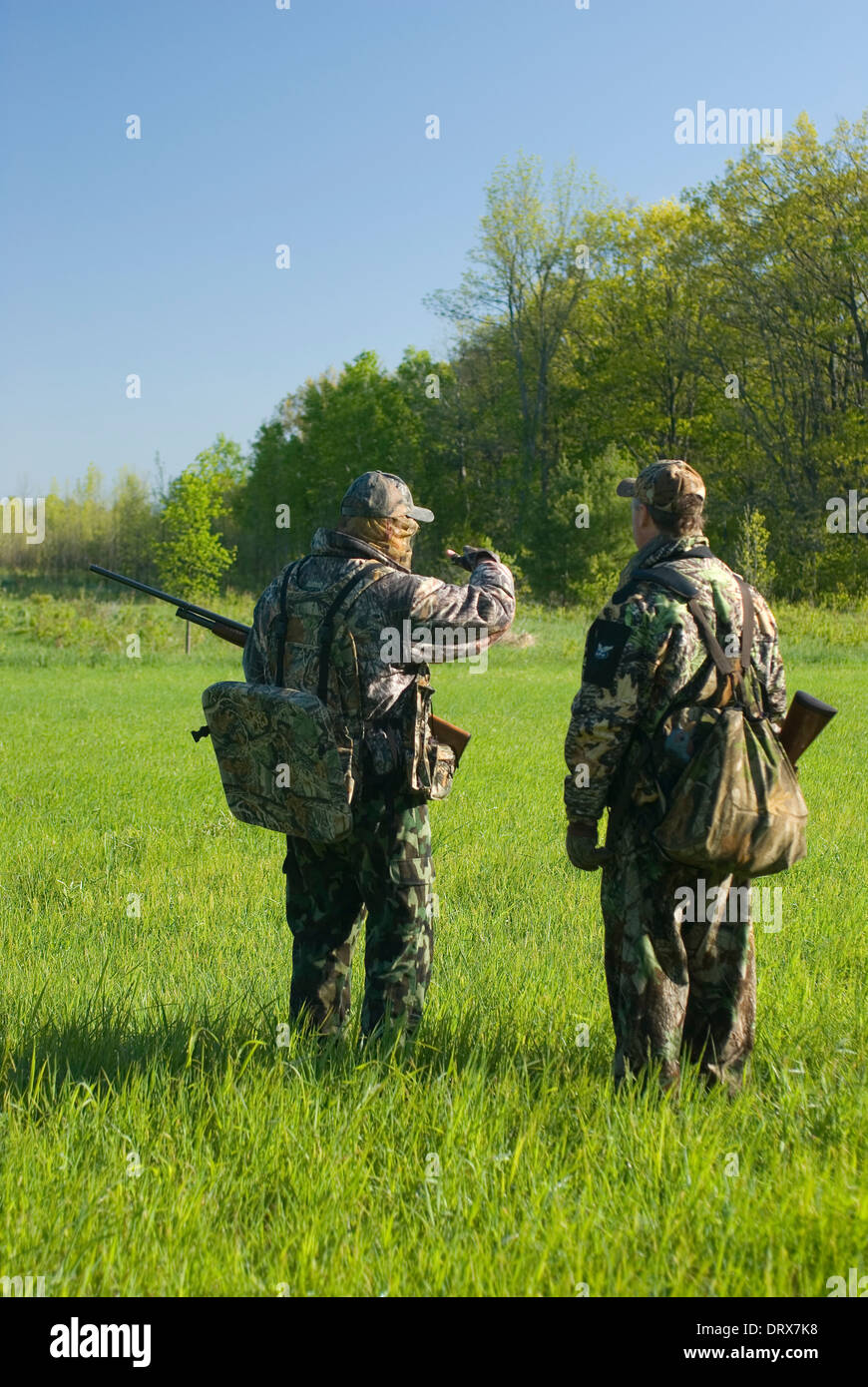 Two hunters plan their strategy for a wild turkey hunt Stock Photo - Alamy