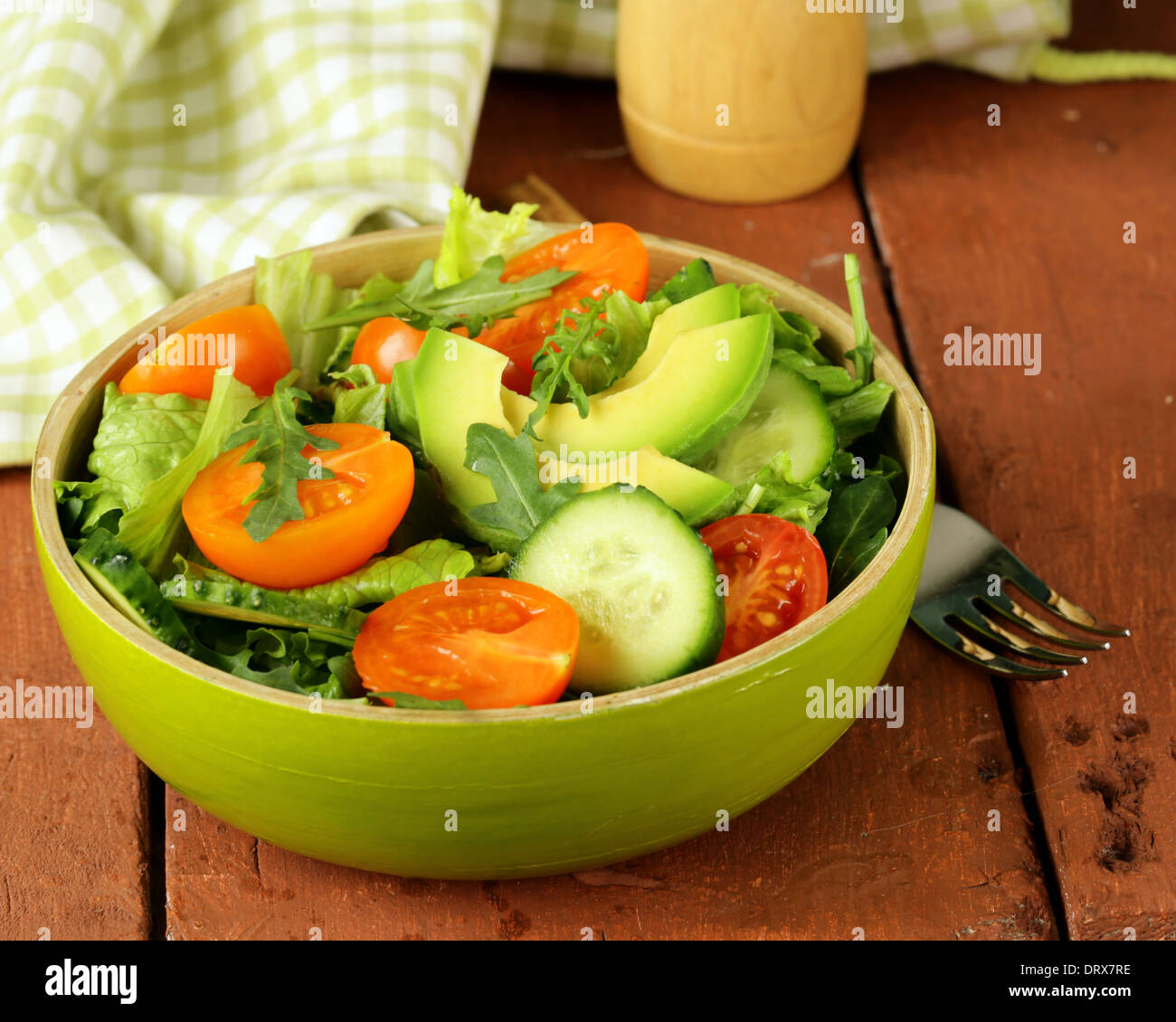 vegetable salad with avocado and tomatoes in rustic style Stock Photo ...