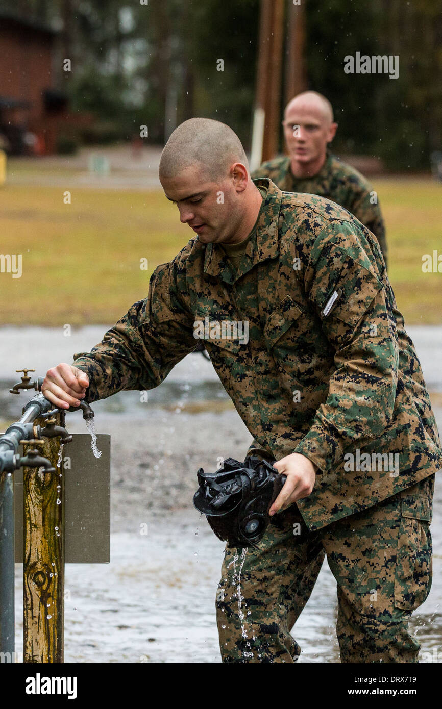 US Marine decontaminate their gas masks after exiting the gas chamber ...