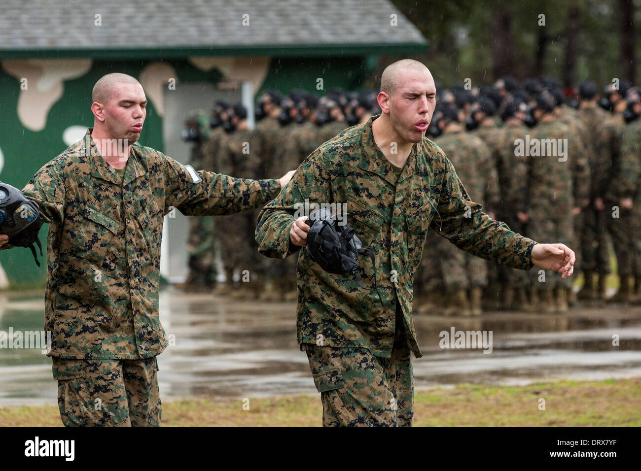 US Marine recruits choke and gasp for air after exiting the gas chamber ...