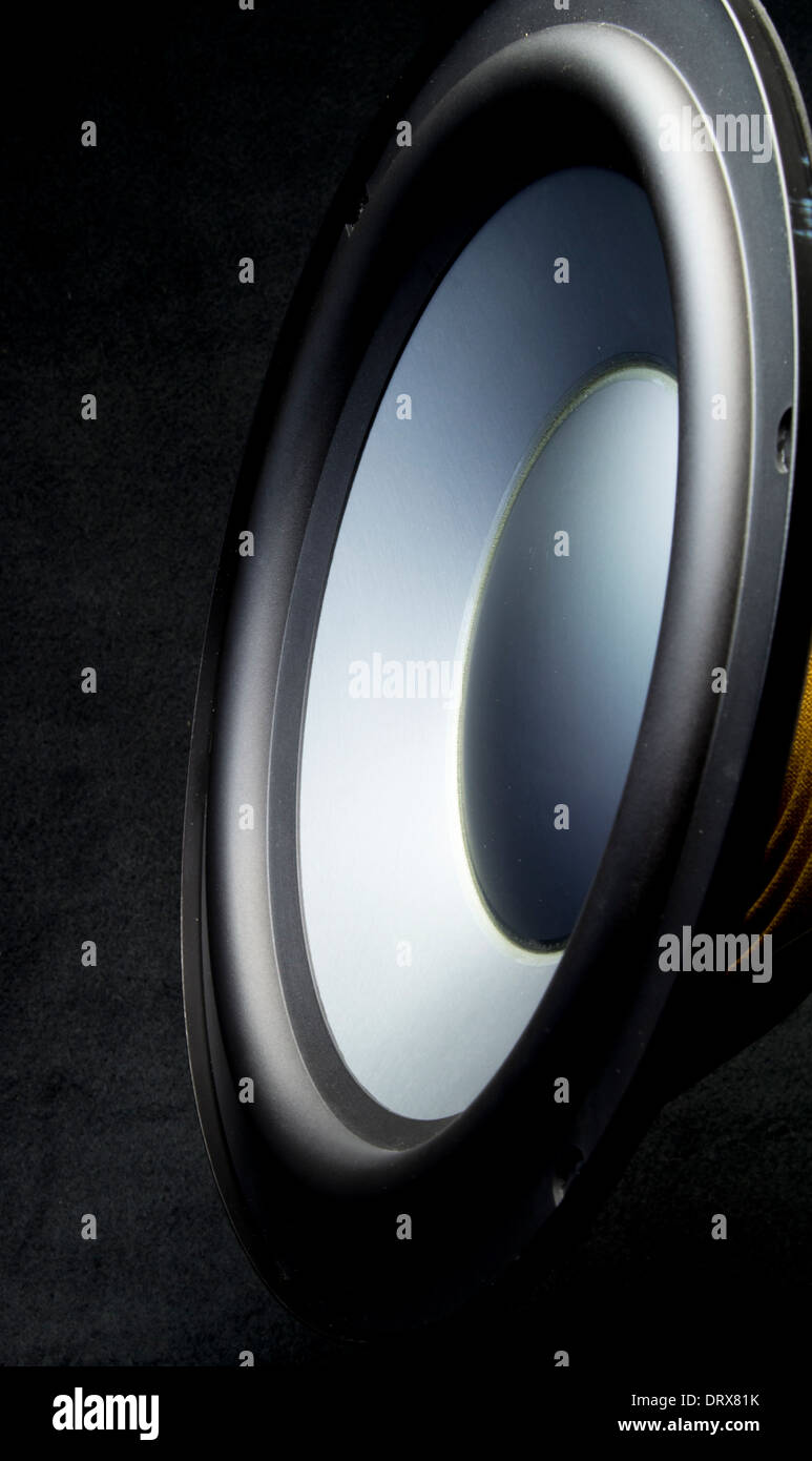 A generic speaker on a black background Stock Photo - Alamy