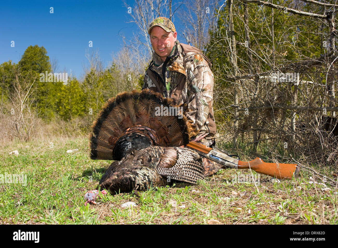 A wild turkey hunter displays his prize Stock Photo - Alamy