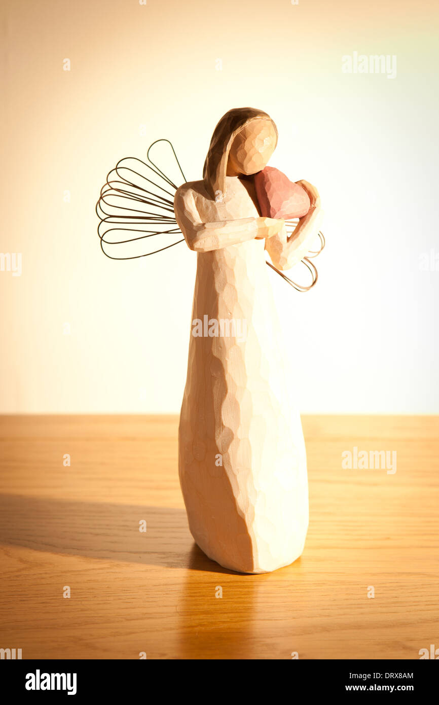Willow Tree Angel with a heart Stock Photo - Alamy