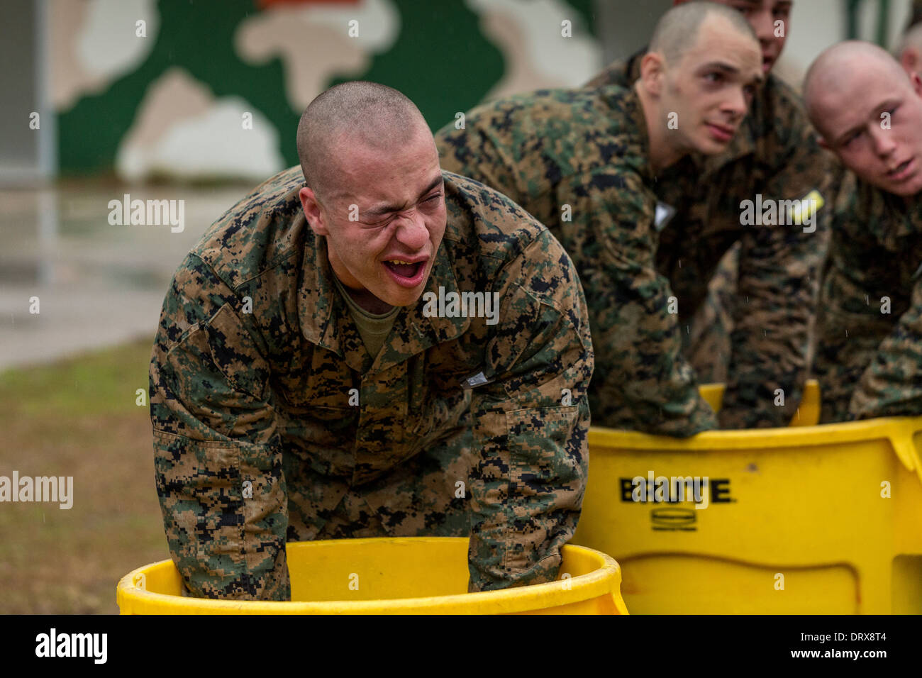 US Marine recruits listen to commands during decontamination after ...