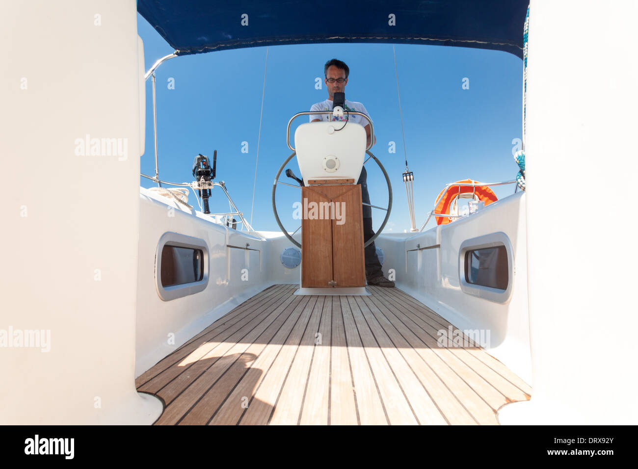 Man steering boat hi-res stock photography and images - Alamy