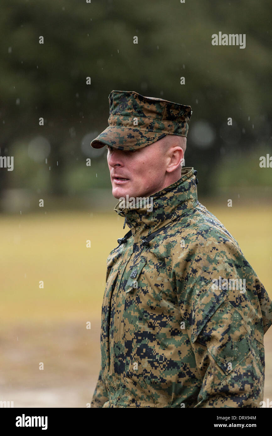 US Marine drill instructor watches recruits fall into formation in a ...