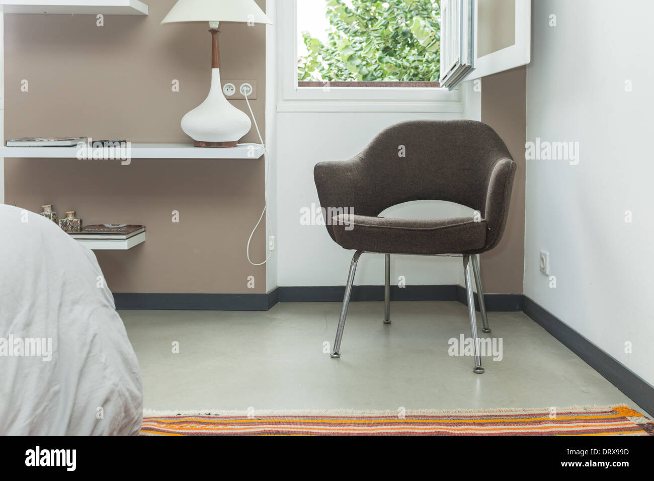 Chair beneath the open window in the bedroom Stock Photo - Alamy