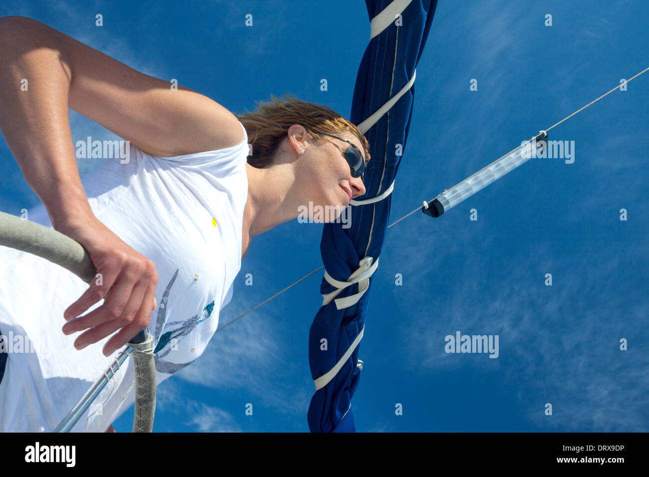 Woman at helm of sailboat hi-res stock photography and images - Alamy