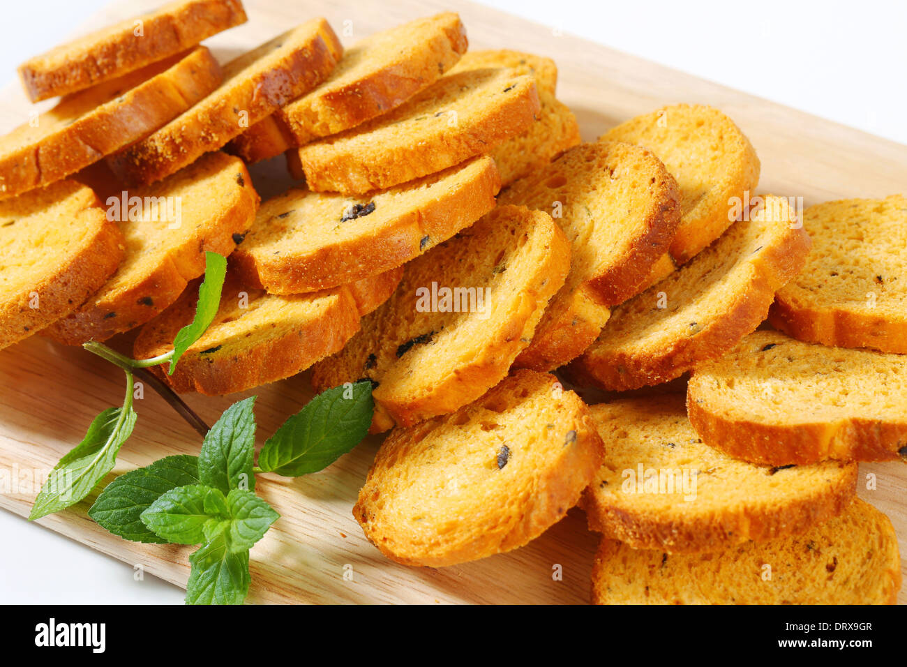 Small round toasts with black olives Stock Photo - Alamy