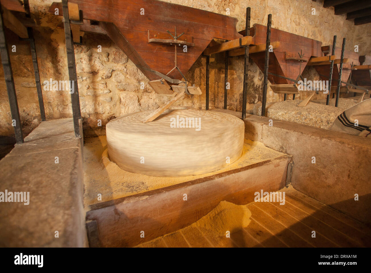 Round mill stone grinding corn Stock Photo - Alamy