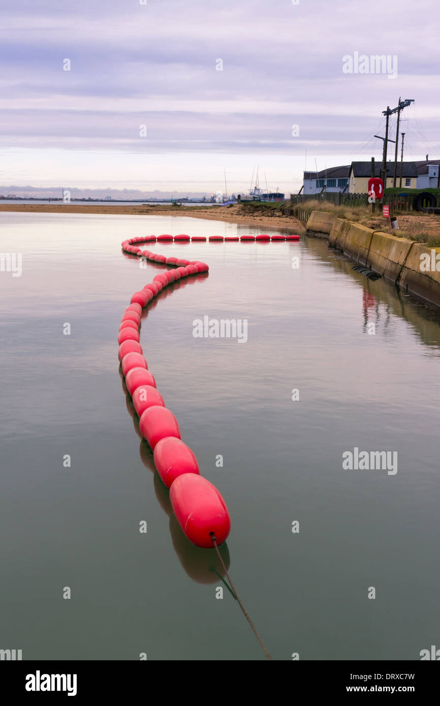 A string of red floats in sea. Snaking into background Stock Photo - Alamy