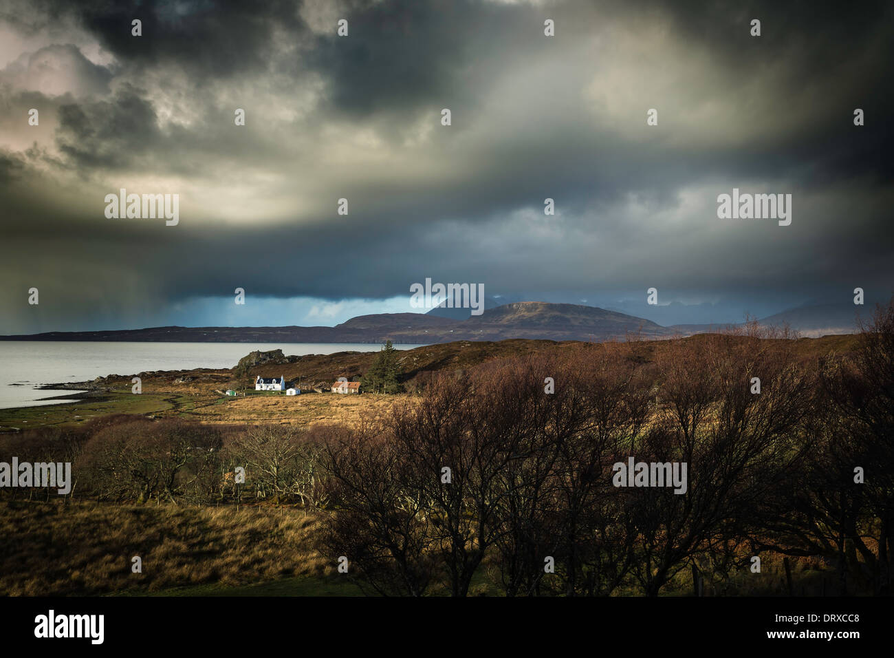 Storm clouds and incoming squall above Strathaird and the Red Cuillins ...