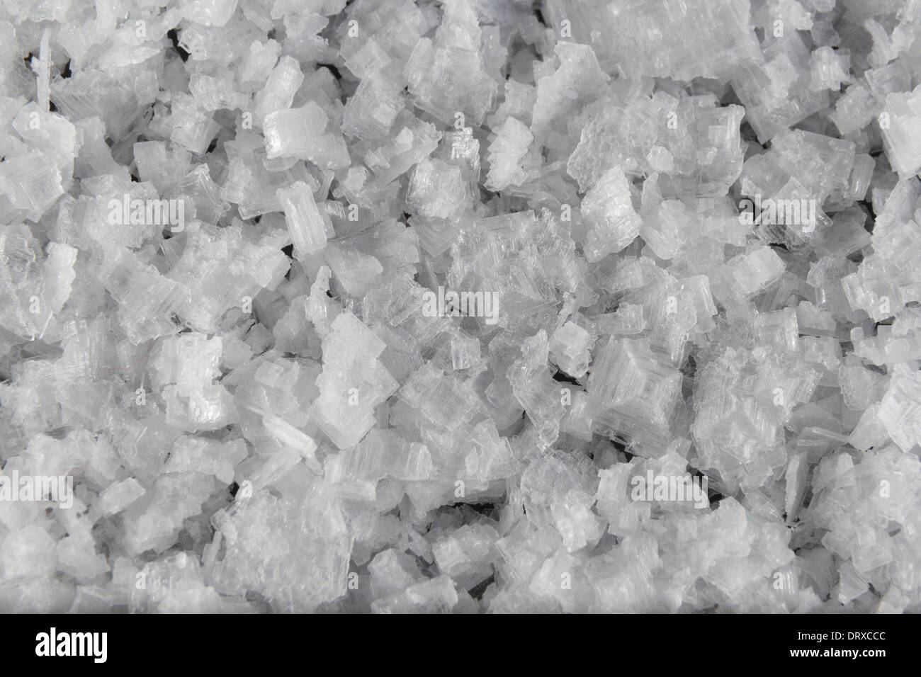 Sea salt flakes, scattered to make background or texture. Macro Stock ...