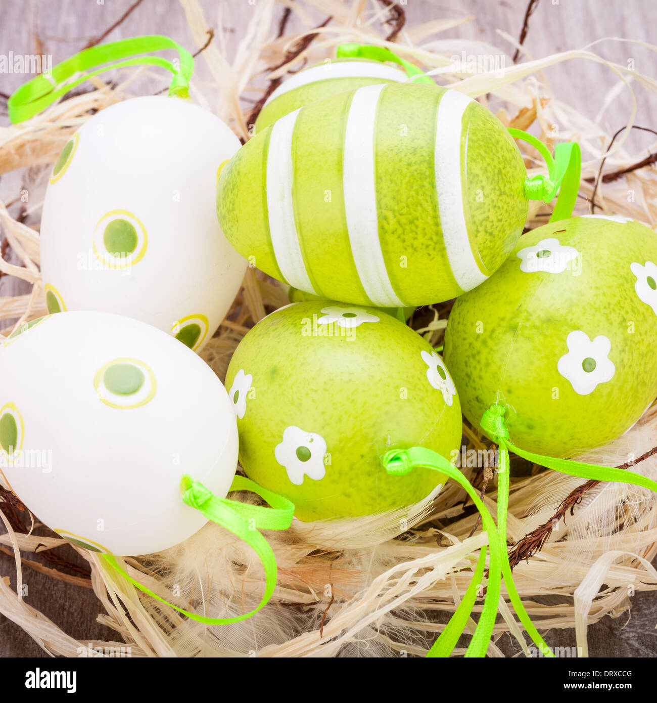 Collection of four hand decorated colourful green Easter eggs with ...