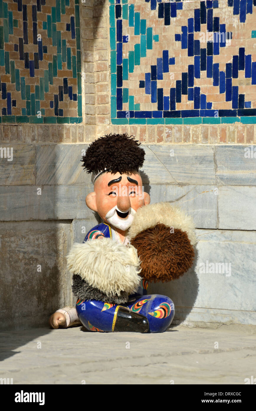 Traditional doll at the entrance to a souvenir shop, Registan ...