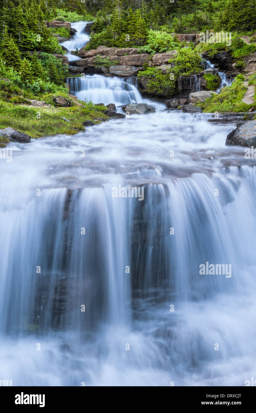 Cascading waterfalls of Lunch Creek along Going to the Sun road near ...