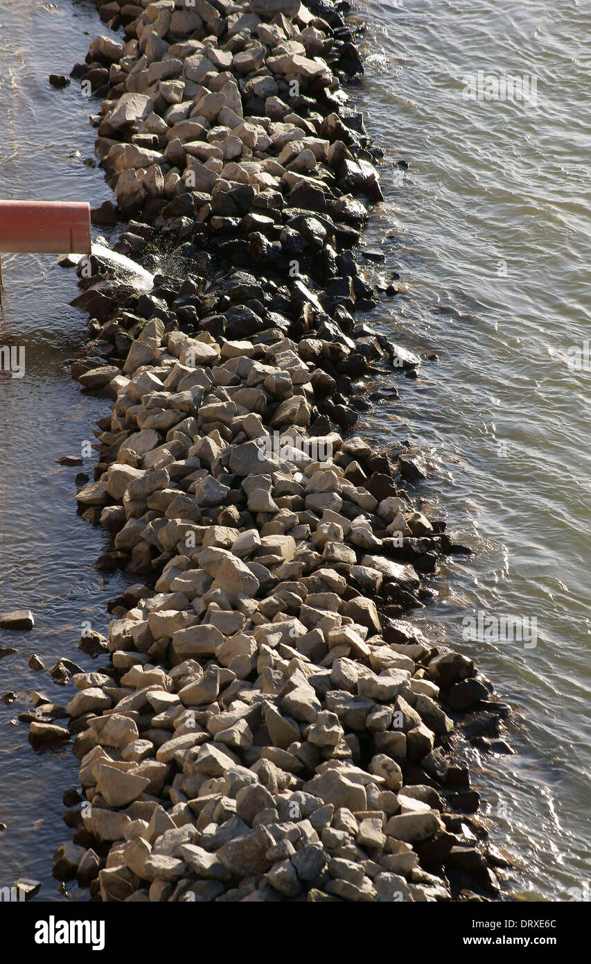 Discharge into the river Stock Photo - Alamy