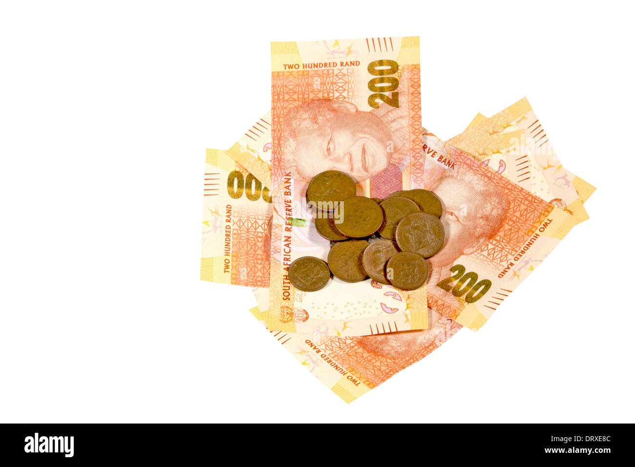 Isolated arrangement of South African bank notes and coins on white ...
